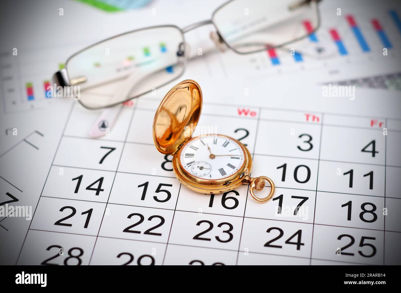 antique gold pocket watch and calendar Stock Photo - Alamy