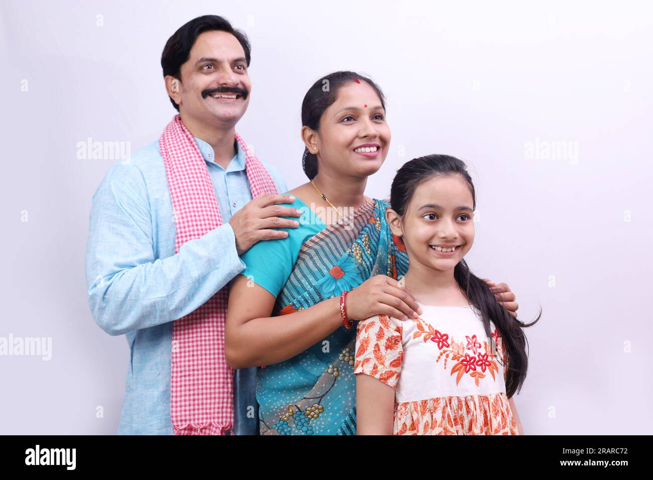 Indian rural happy villager family of a father, mother and daughter ...