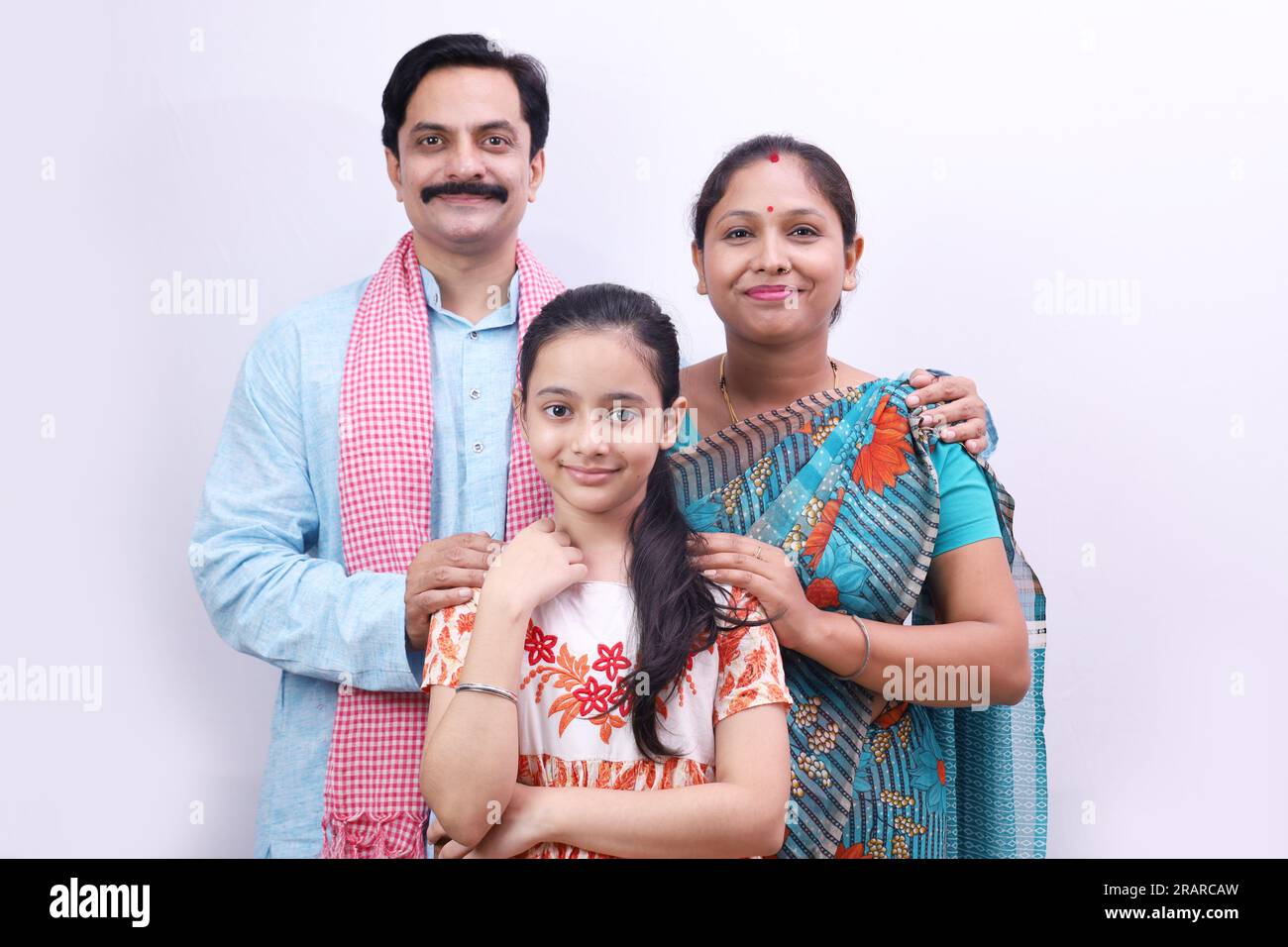 Indian rural happy villager family of a father, mother and daughter ...