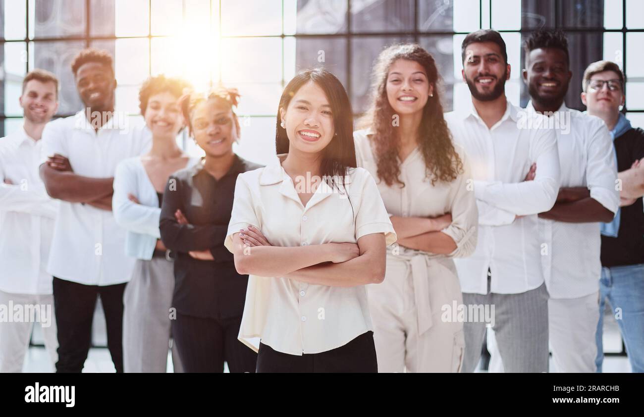 happy team of diverse corporate employees in the office lobby Stock ...