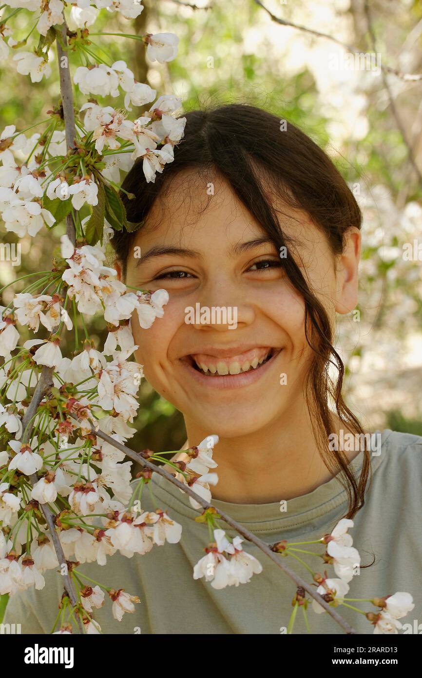Girl under a tree hi-res stock photography and images - Alamy