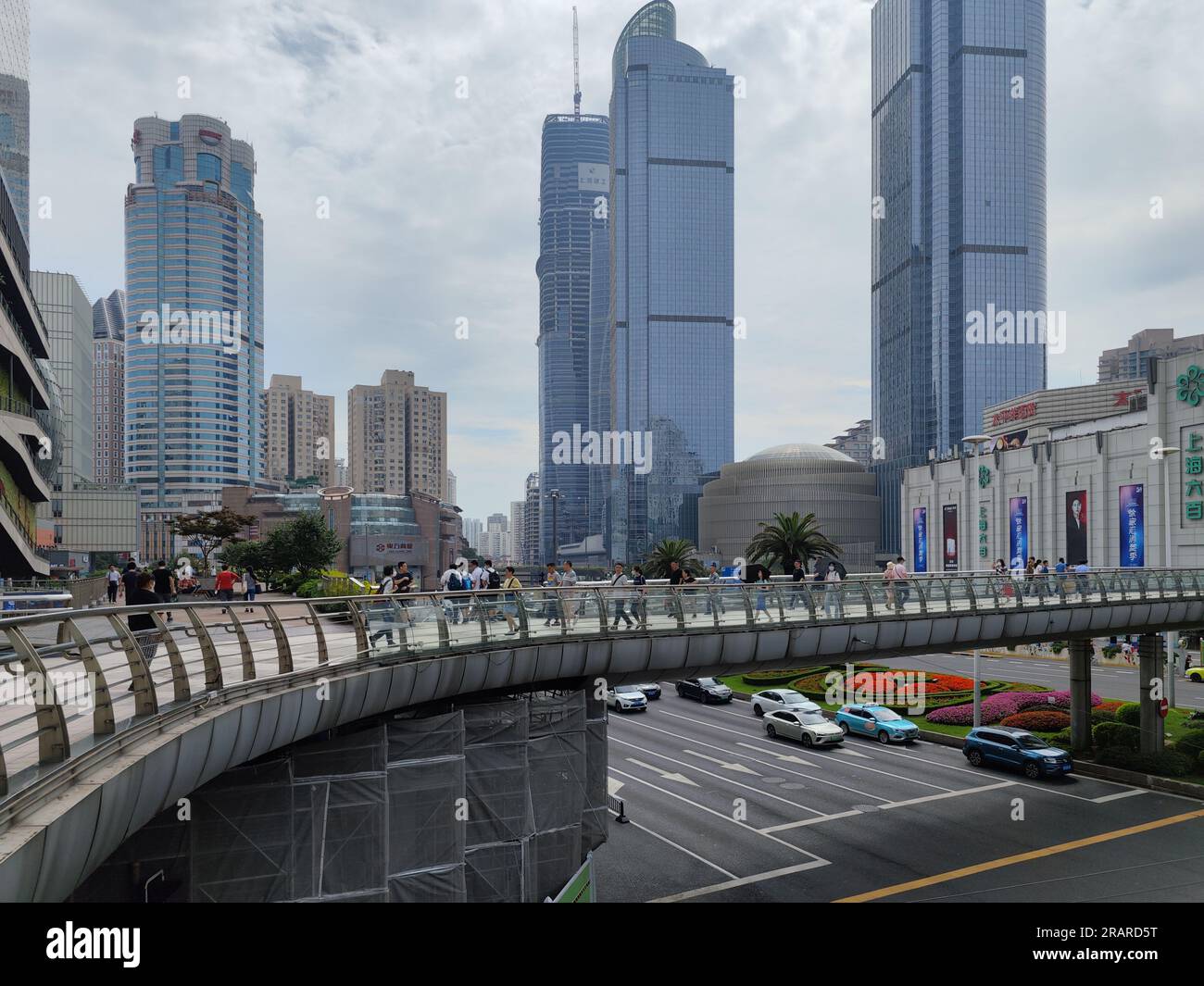 Pedestrian overpass bridge at Xujiahui area with shopping mall ...