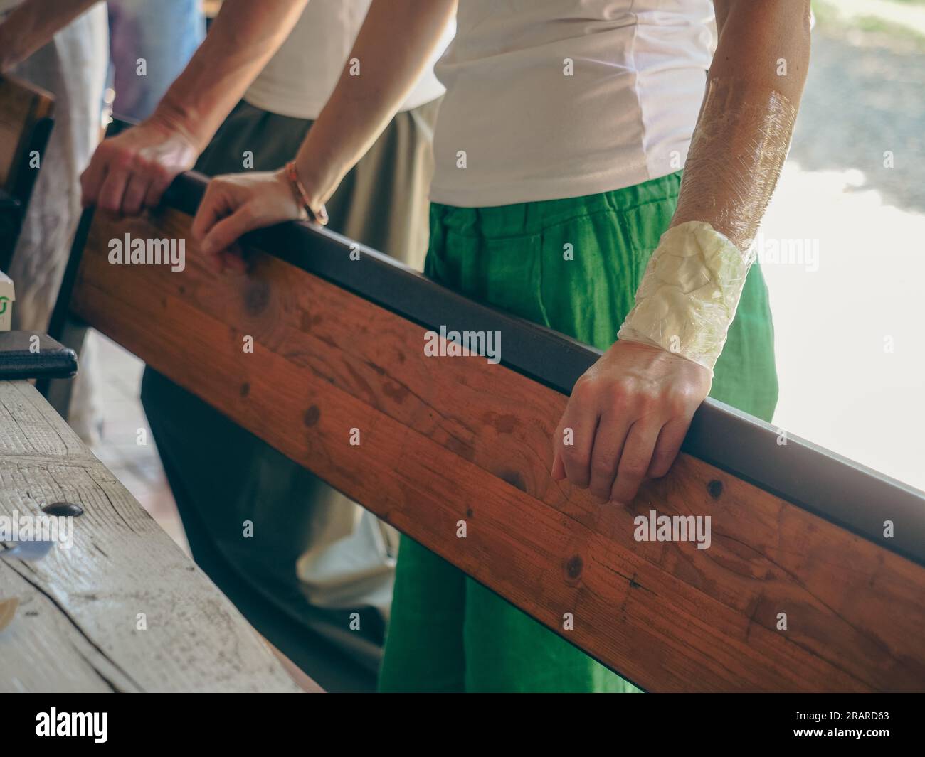 woman wrist wrapped in cabbage leaves compress for anti inflammatory ...