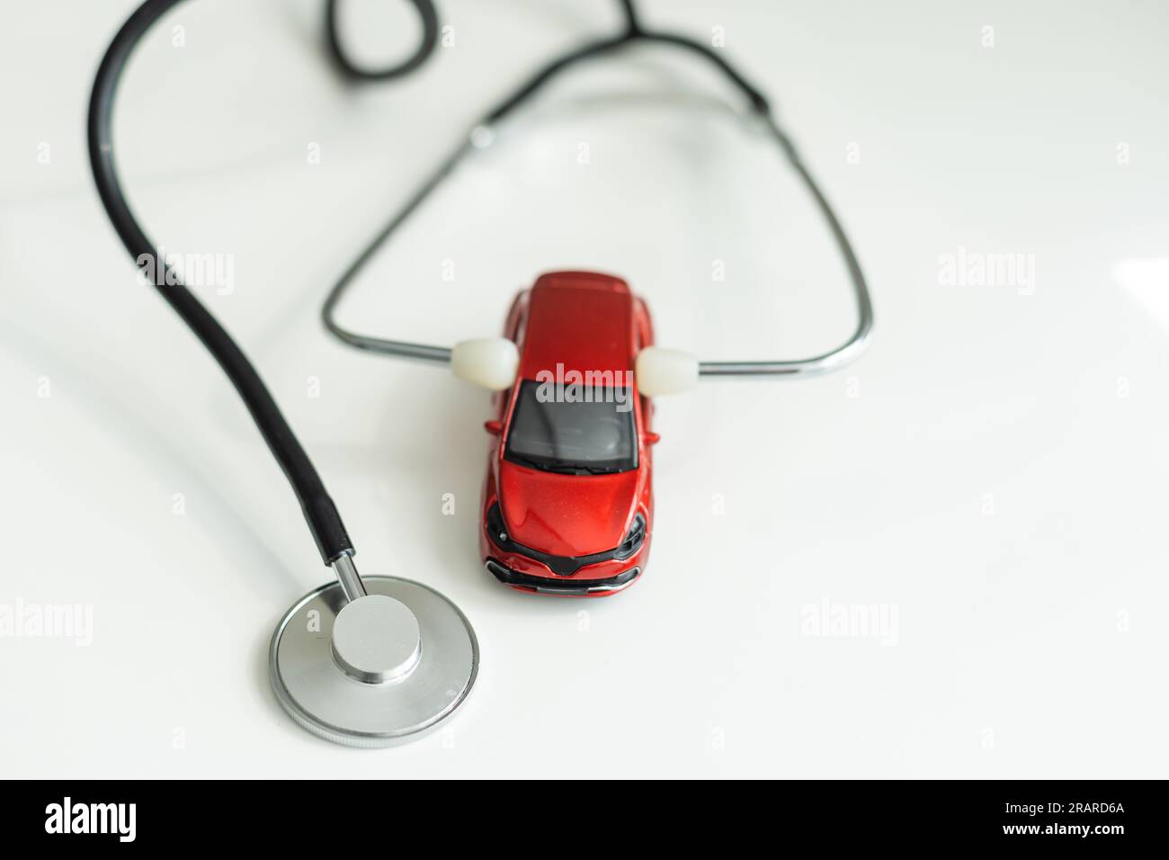Toy car and stethoscope. Car automotive diagnostic, inspection, repair ...