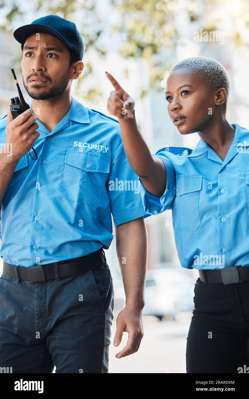 Security guard, safety officer and pointing on street for protection ...