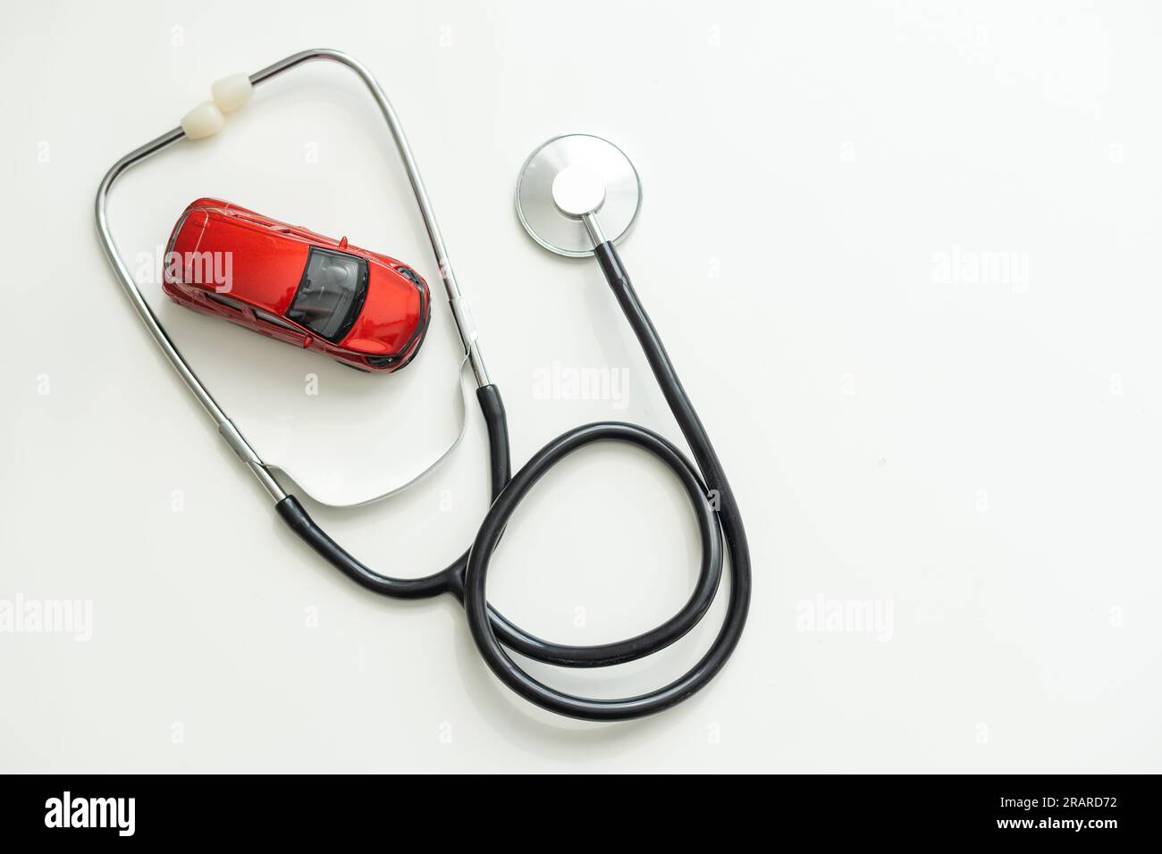 Car diagnostics, stethoscope and car on white background, concept of ...