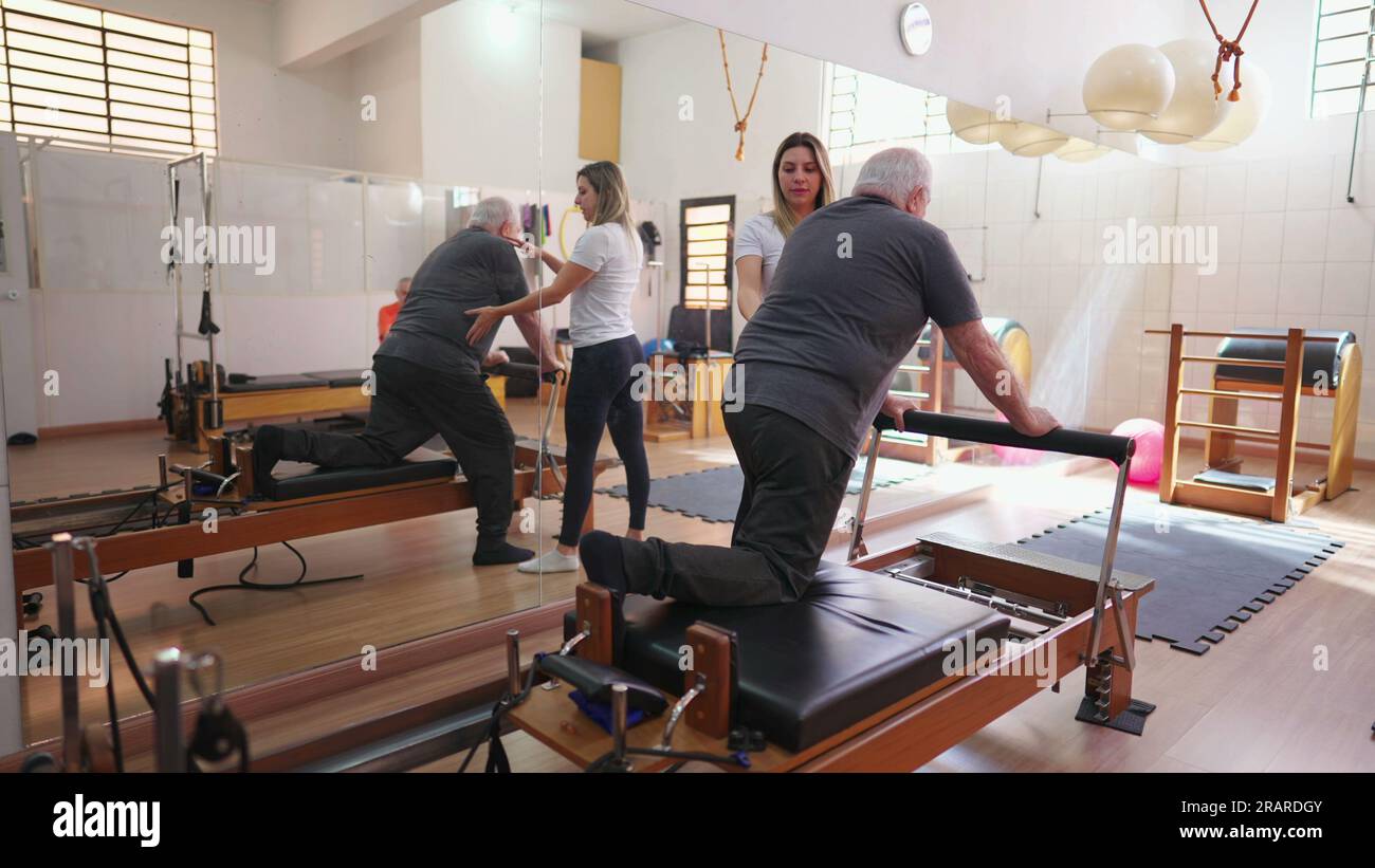 Instructor guiding senior man hi-res stock photography and images - Alamy