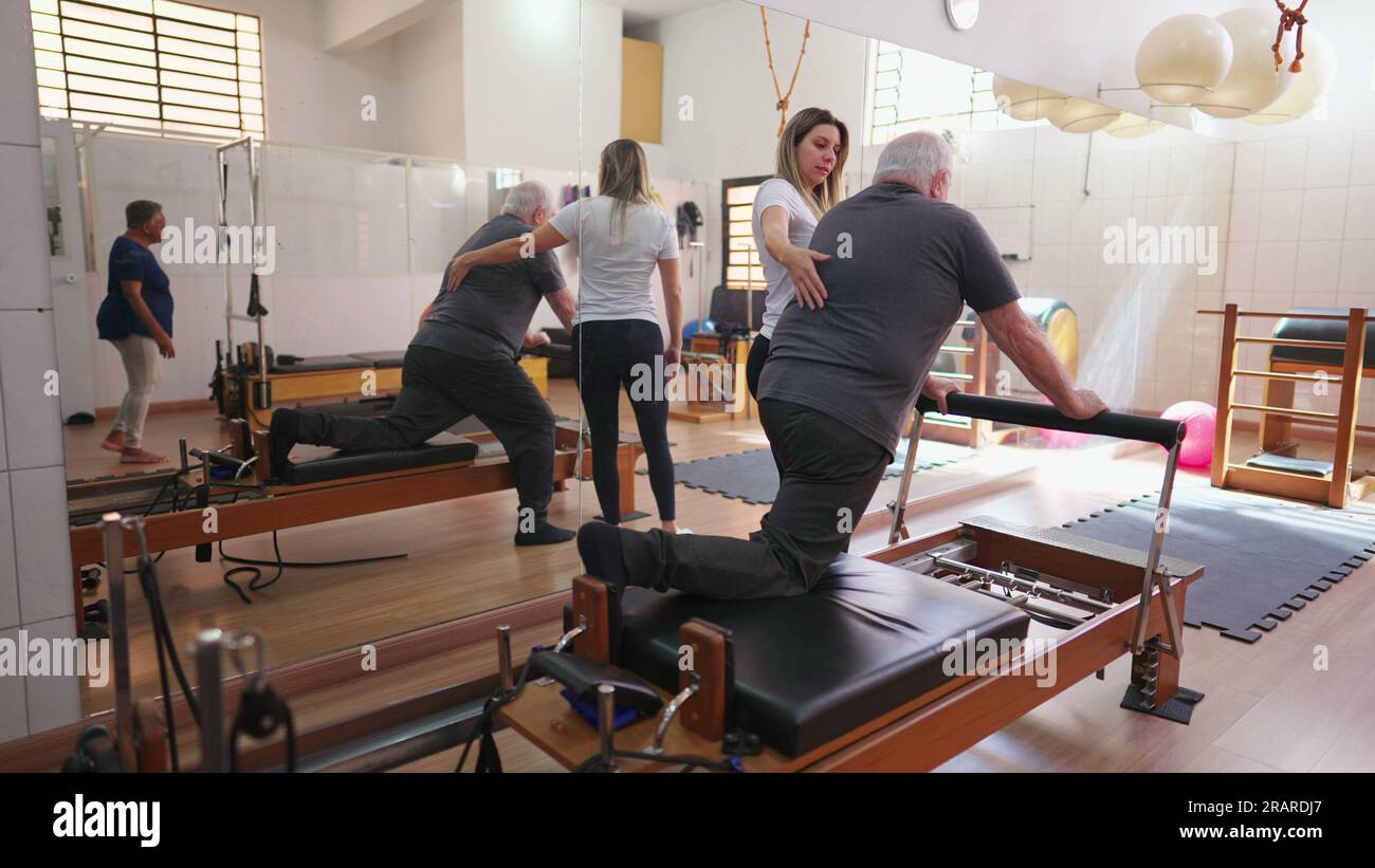 Instructor guiding senior man hi-res stock photography and images - Alamy