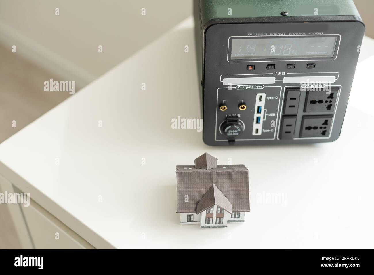 Portable power station charging gadgets on table in room. Home Stock ...
