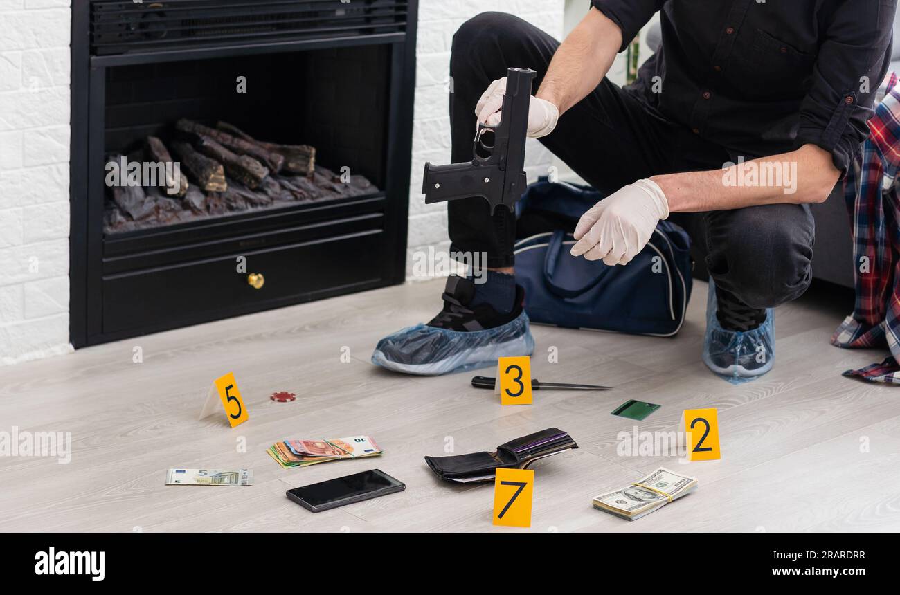 Detective Collecting Evidence in a Crime Scene. Forensic Specialists ...