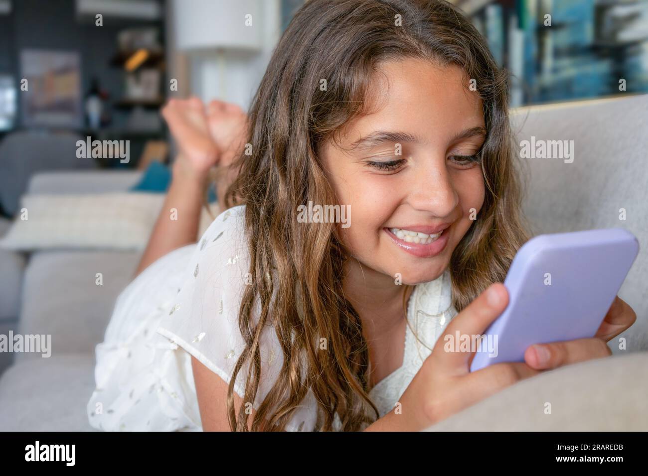 Digital Fun. Happy Preteen Girl Using Smartphone Texting And Scrolling Social Media Application ...