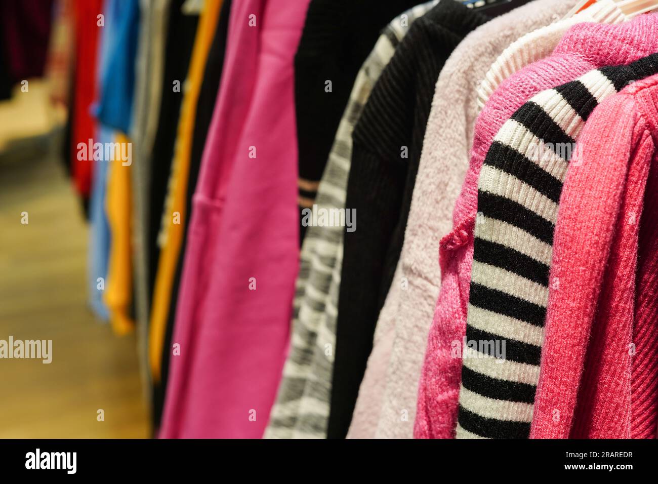 Clothes on hangers in hi-res stock photography and images - Alamy