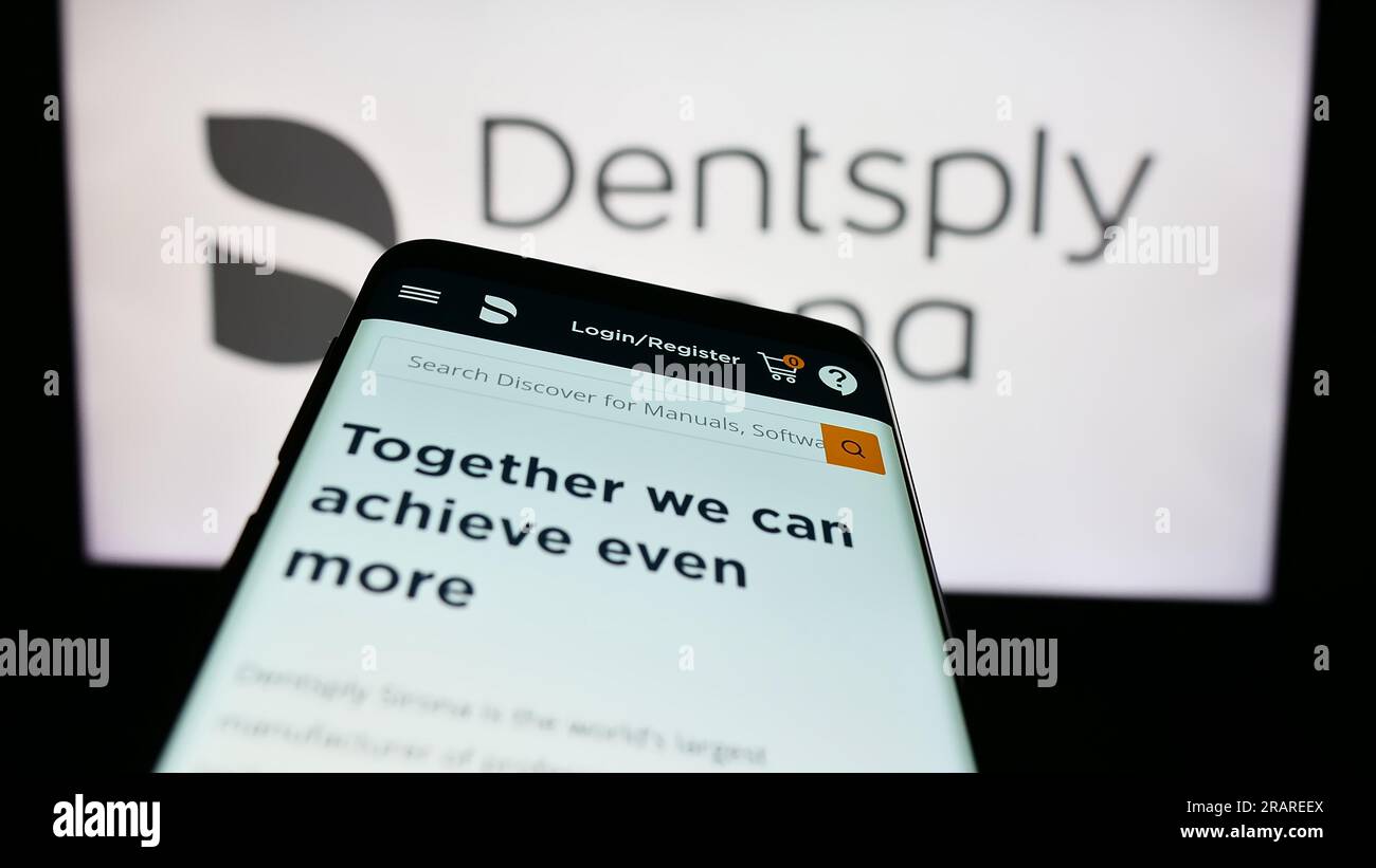 Smartphone with webpage of US dental equipment company Dentsply Sirona ...