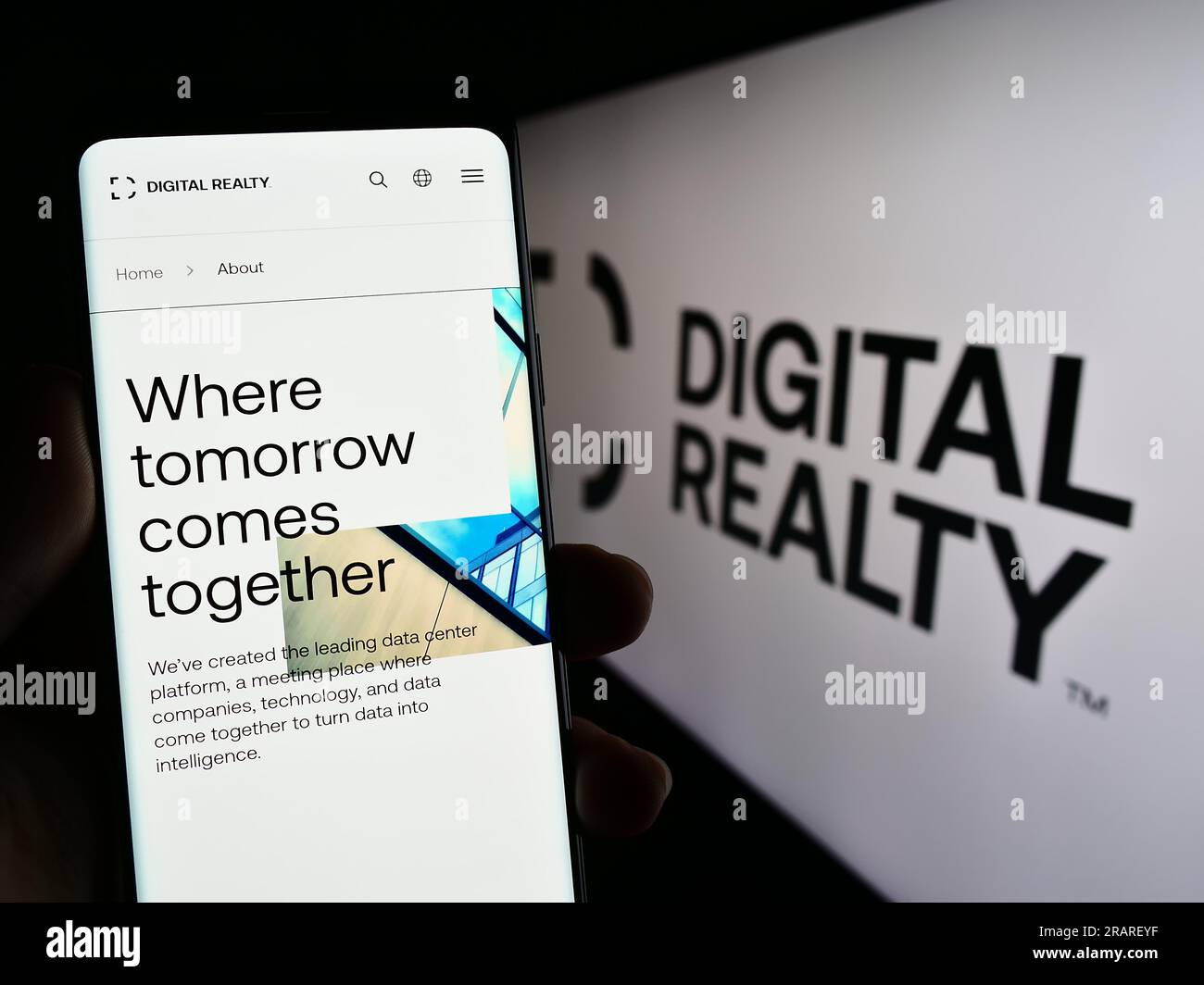 Person holding mobile phone with website of data center company Digital ...