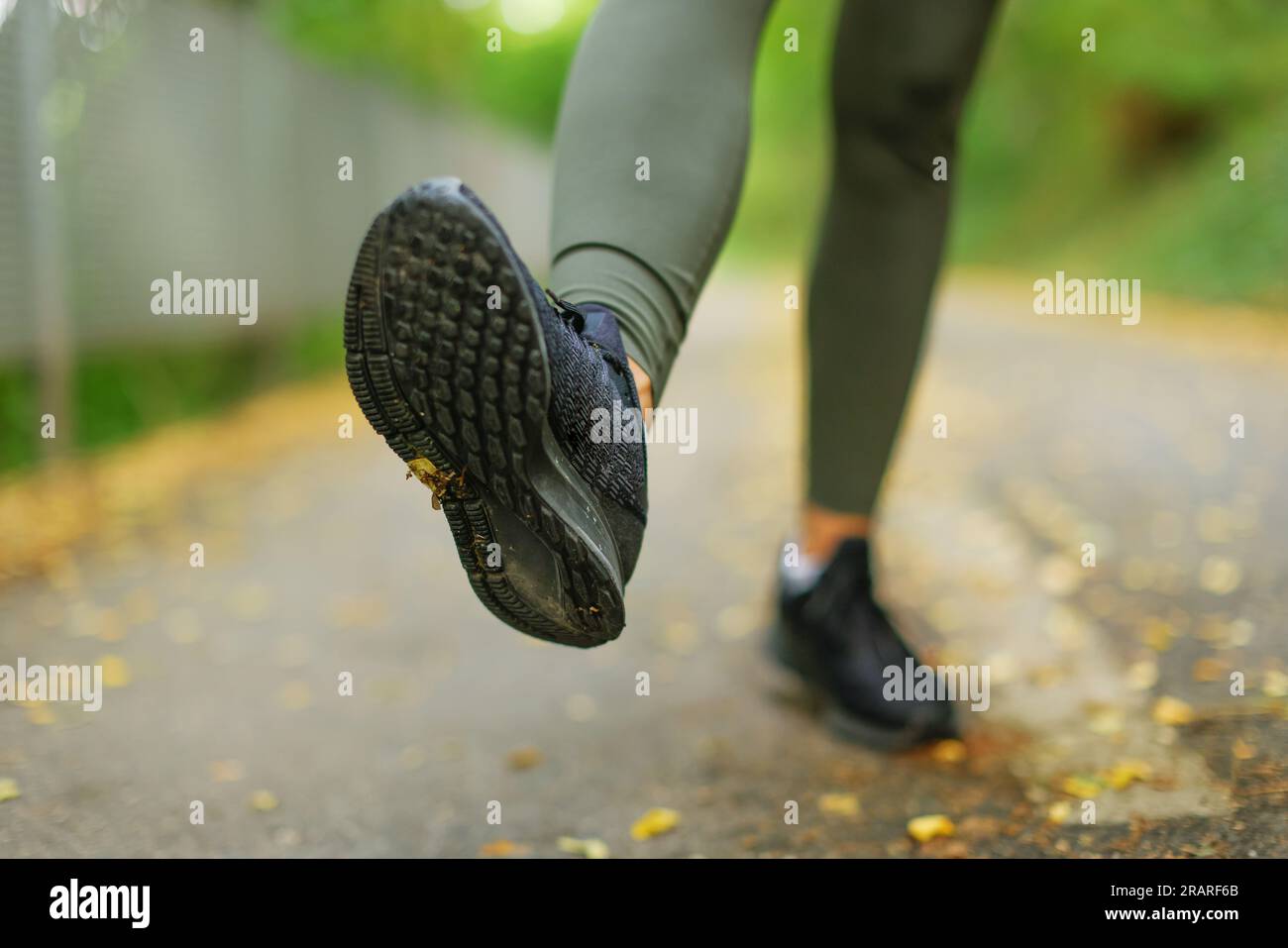 Athlete runner feet running on treadmill closeup on shoe Stock Photo ...