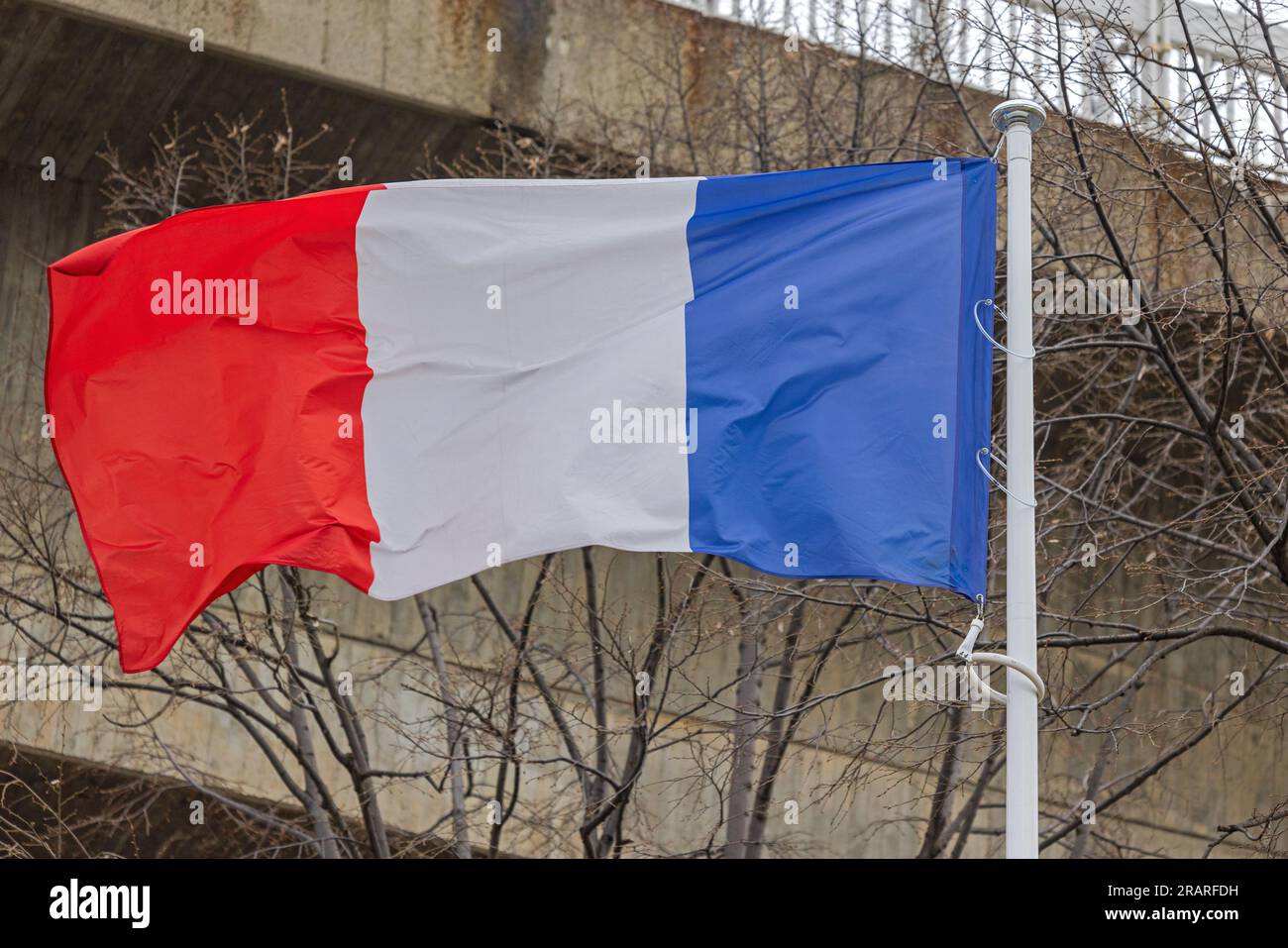 Republic of France Tricolor Flag in Front of Concrete Building Stock ...