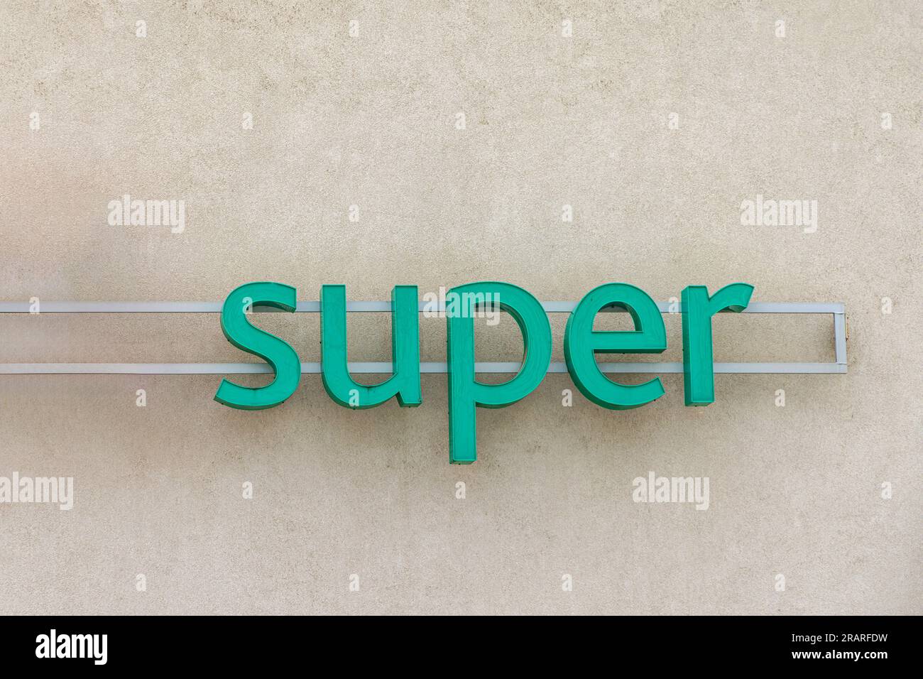 Green 3d Text Sign Super at Building Wall Stock Photo - Alamy