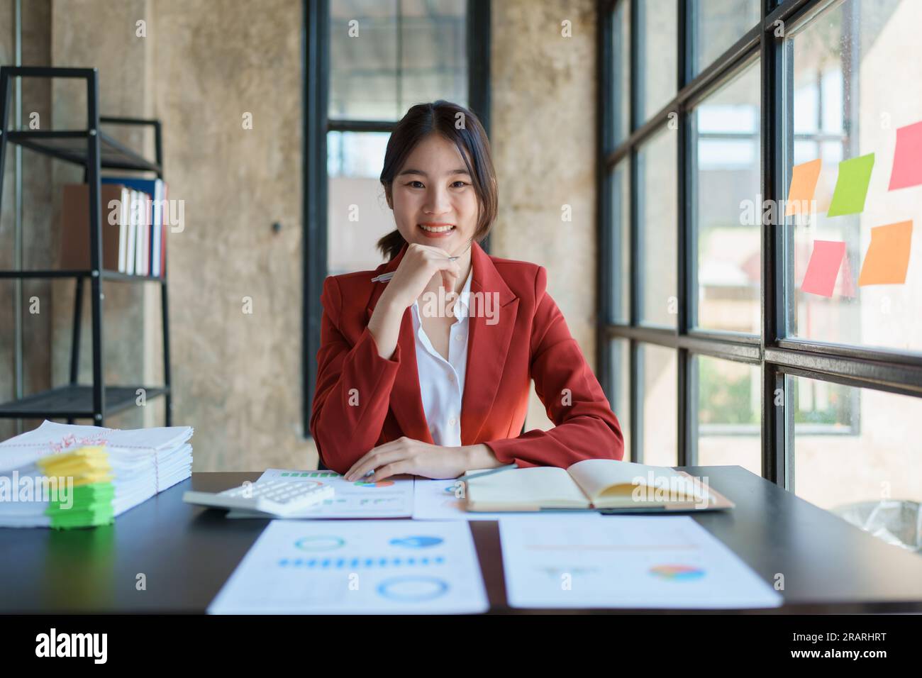Portrait of a woman business owner showing a happy smiling face as he ...