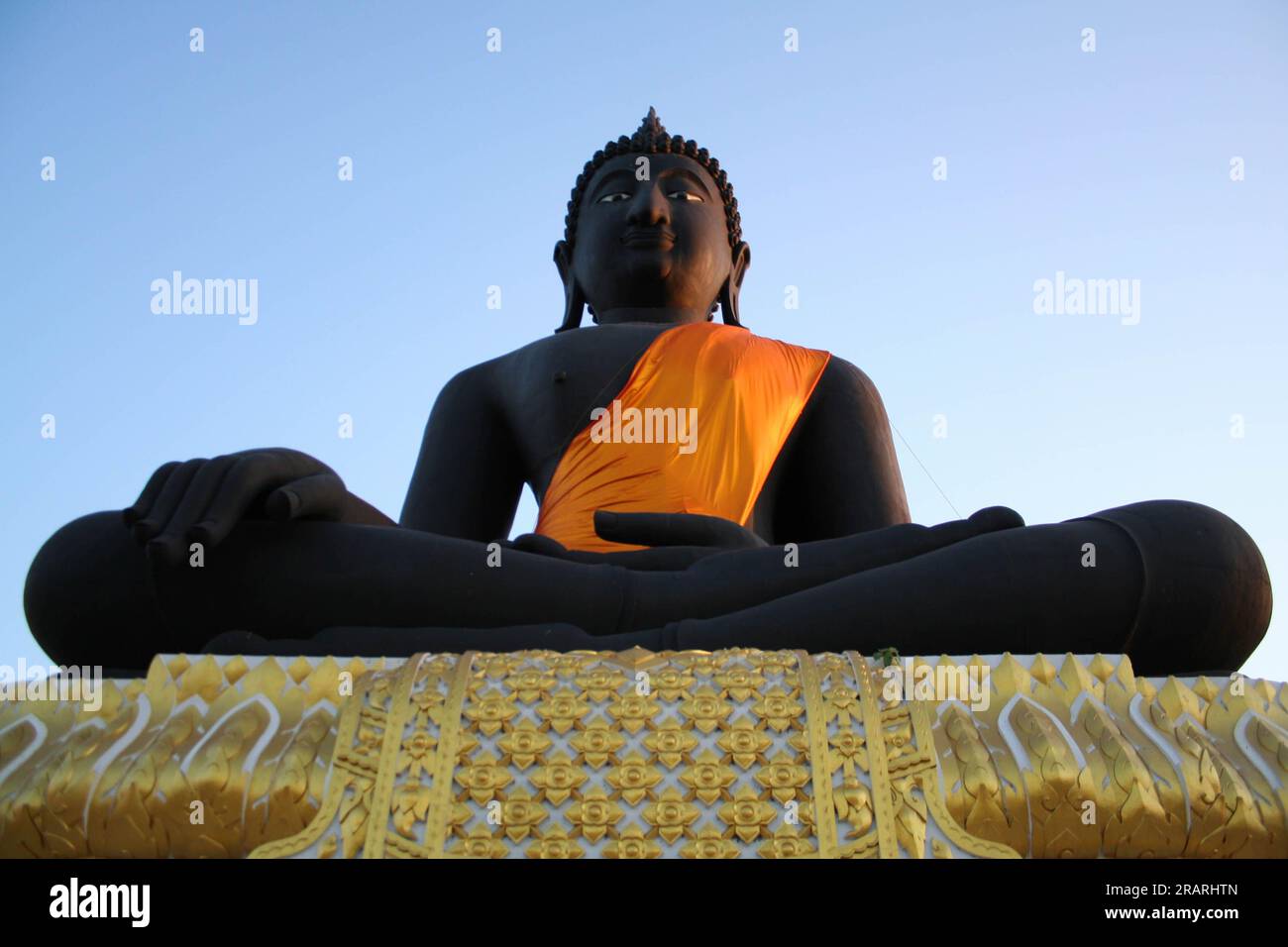 Big black buddha statue with clear blue sky Stock Photo - Alamy