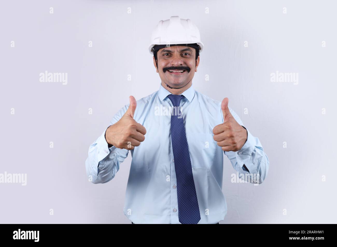 Construction worker doing thumbs up for a better future. The cheerful ...