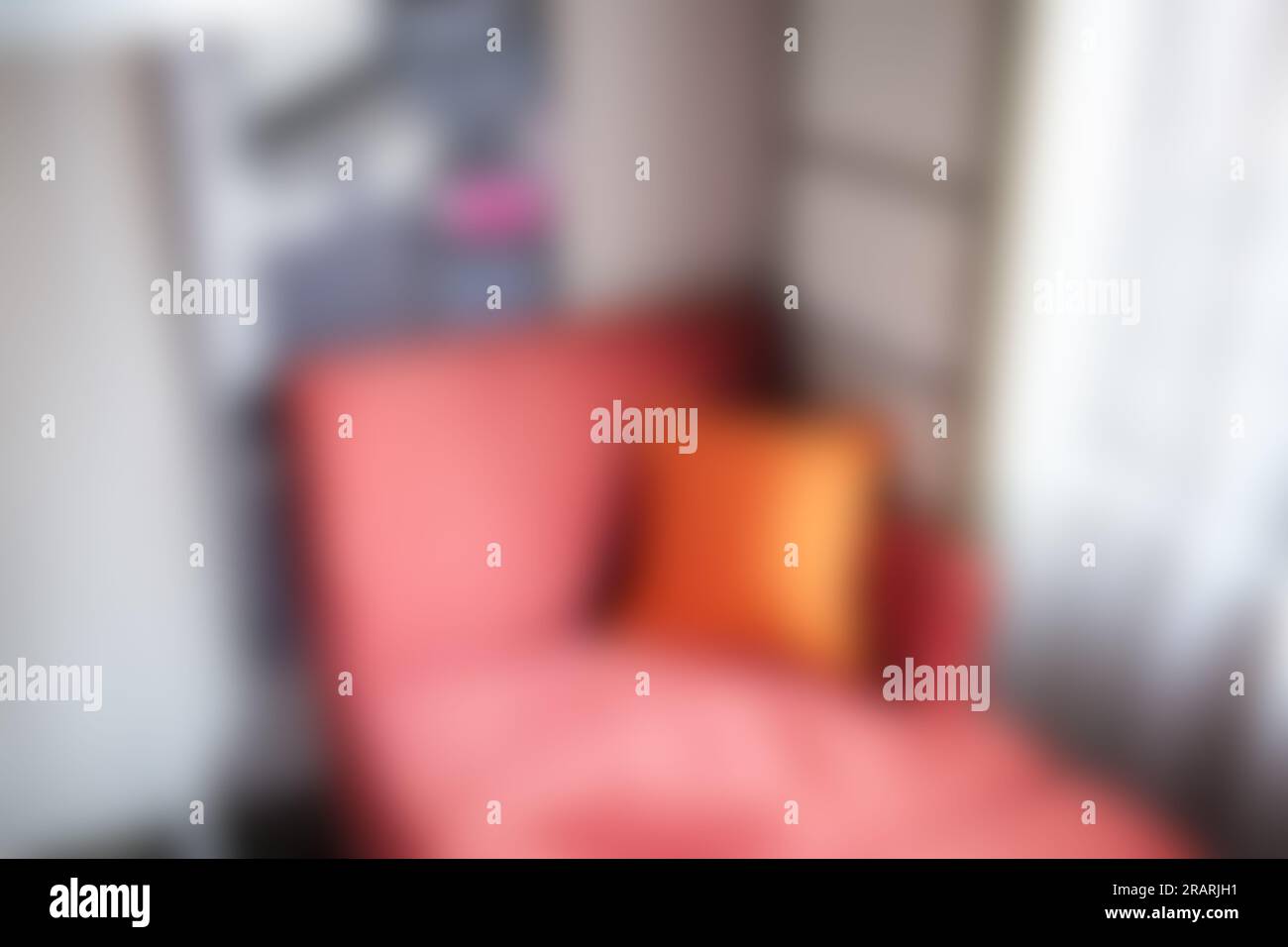 Blur interior design with red sofa and pillow Stock Photo - Alamy