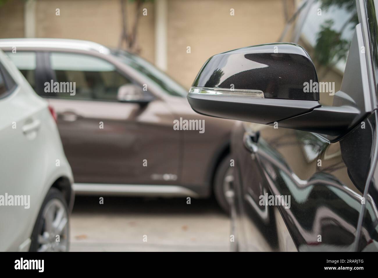 Closeup luxury car side mirror Stock Photo - Alamy