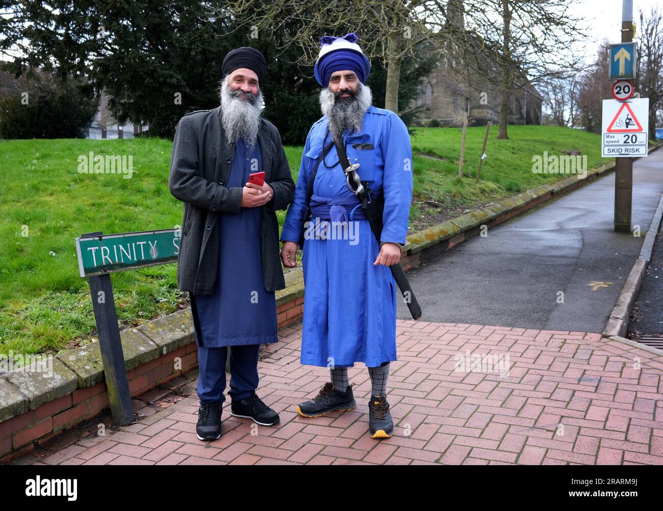 Traditional and modern local Sikh men chatting in Smethwick, West ...