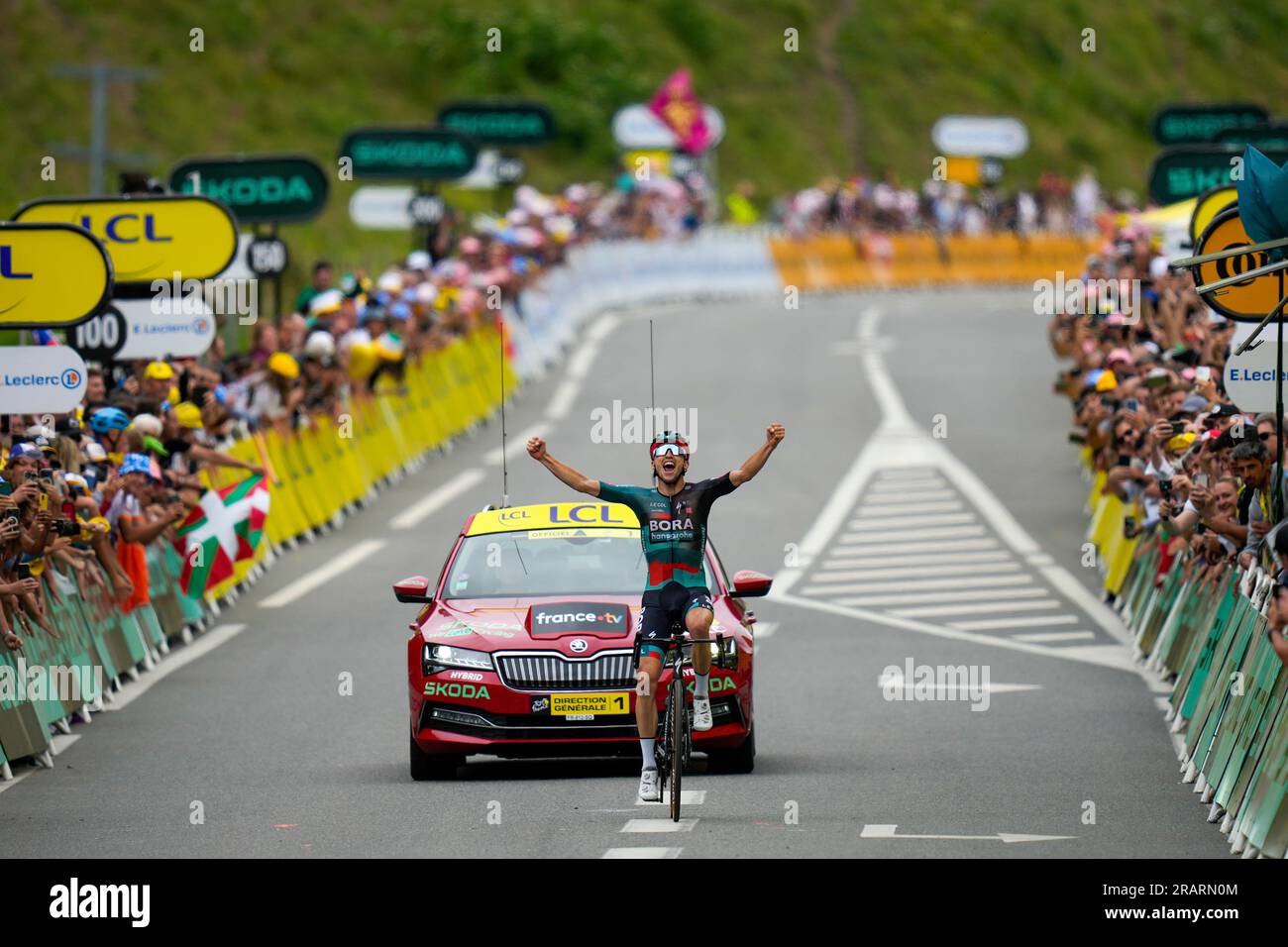 Australia's Jai Hindley crosses the finish line to win the fifth stage ...