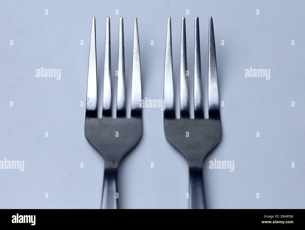 two forks isolated on white background Stock Photo - Alamy