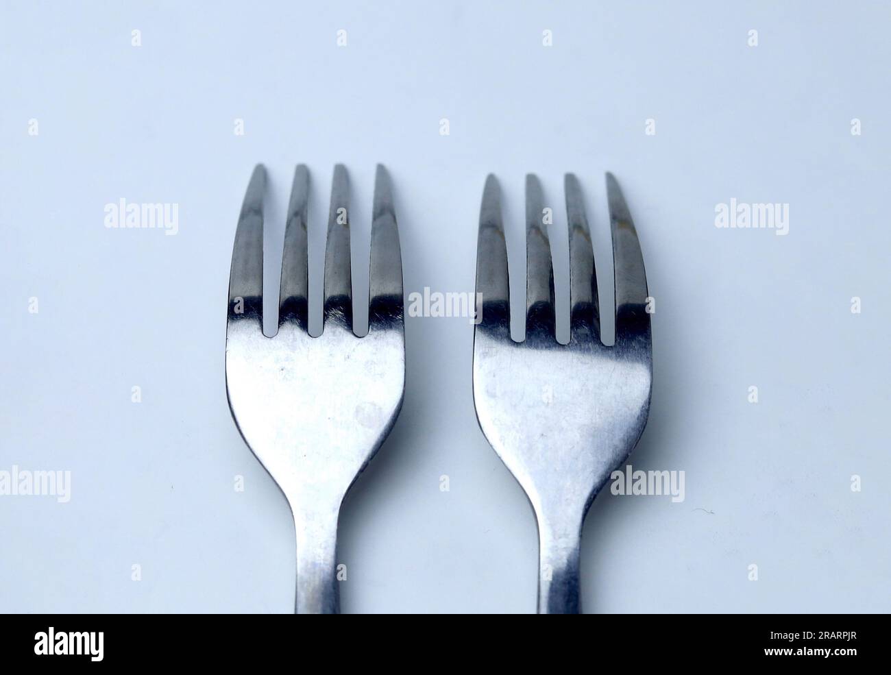 two forks isolated on white background Stock Photo - Alamy