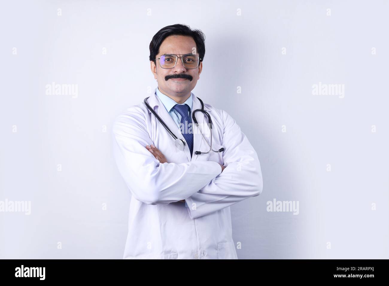Portrait of happy Indian doctor in uniform wearing stethoscope and ...
