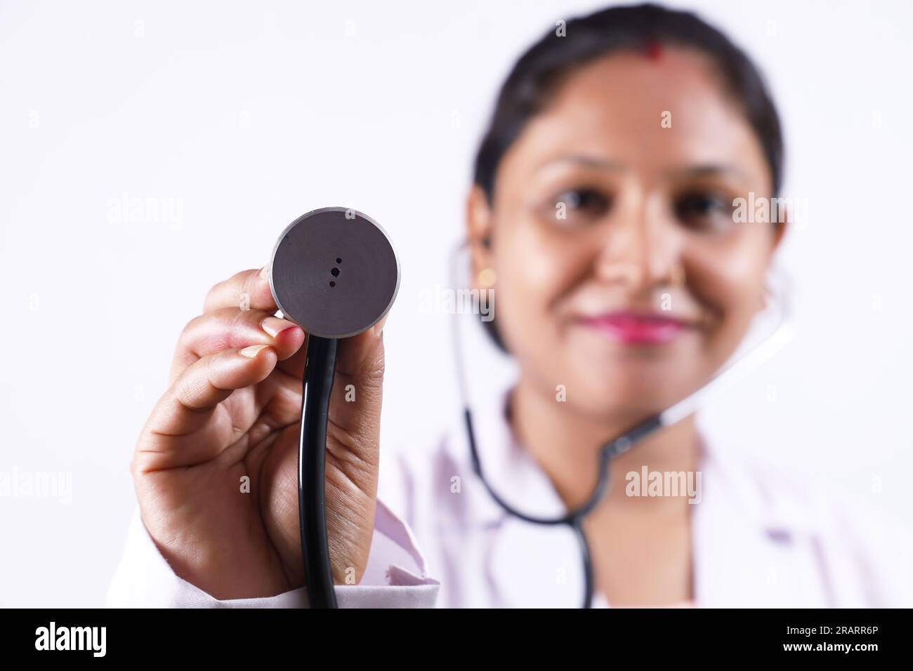 Beautiful portrait of a happy Indian female doctor in uniform wearing ...