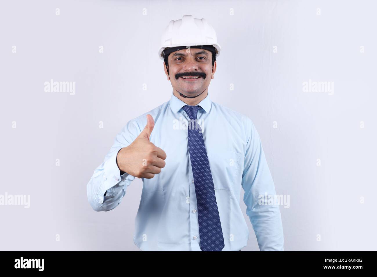 Happy Indian Construction worker doing engineer concept for a better ...