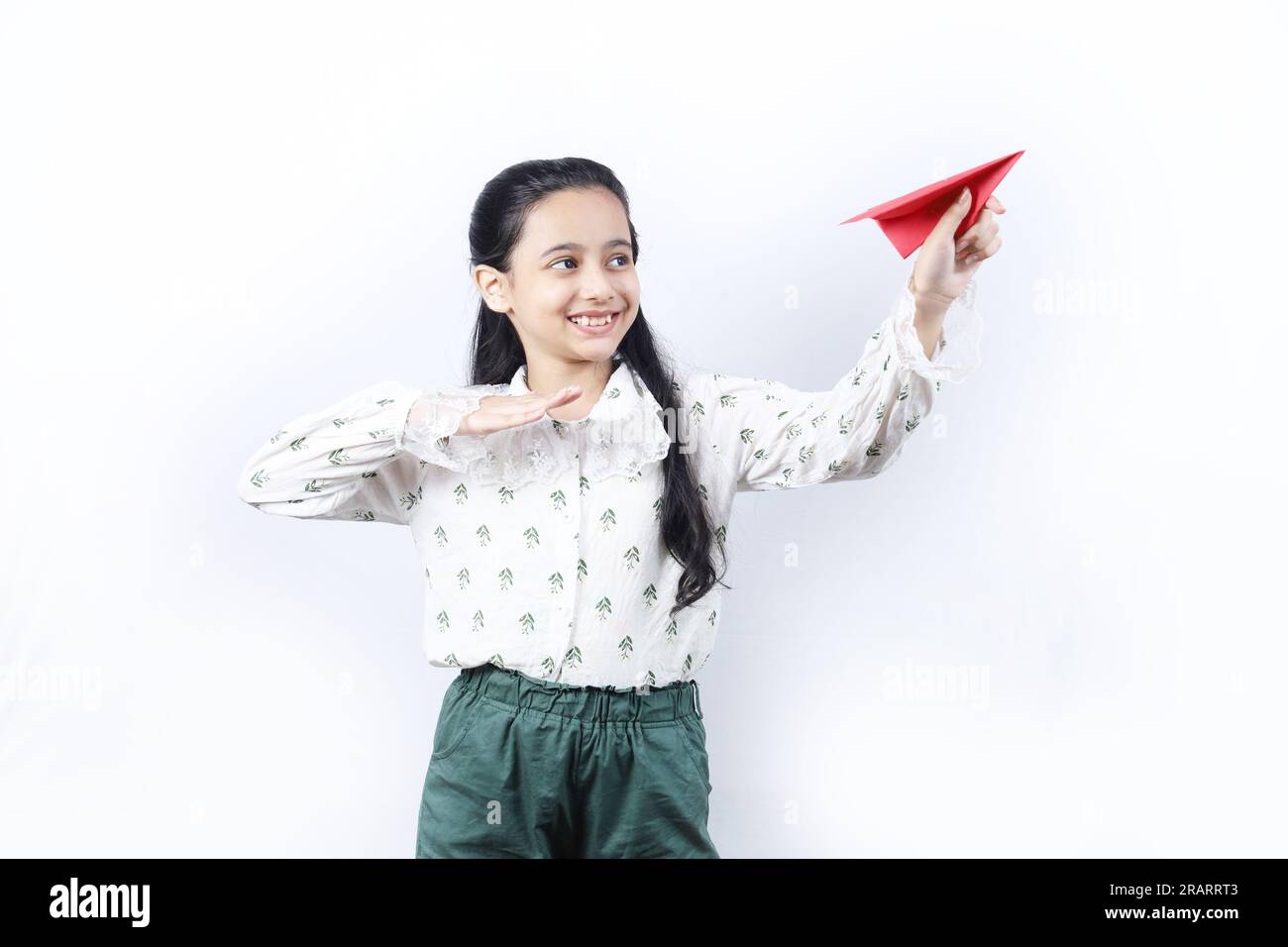 Happy Indian school kid playing with paper airplane and dreaming about ...