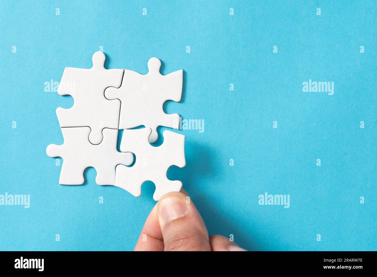 Four pieces of plain white jigsaw puzzle for business concept Stock ...