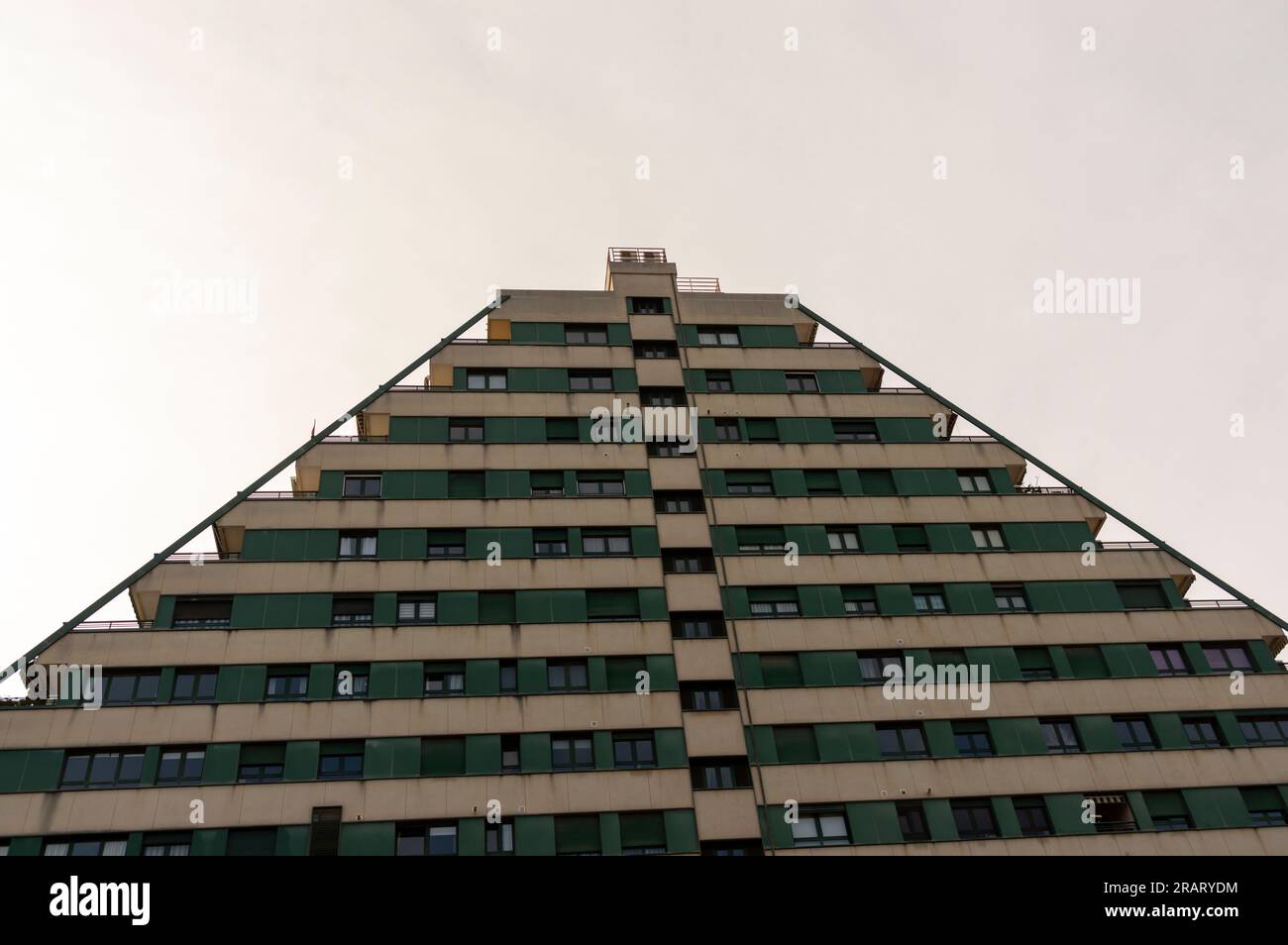 pyramid-shaped residential building on a cloudy day Stock Photo - Alamy