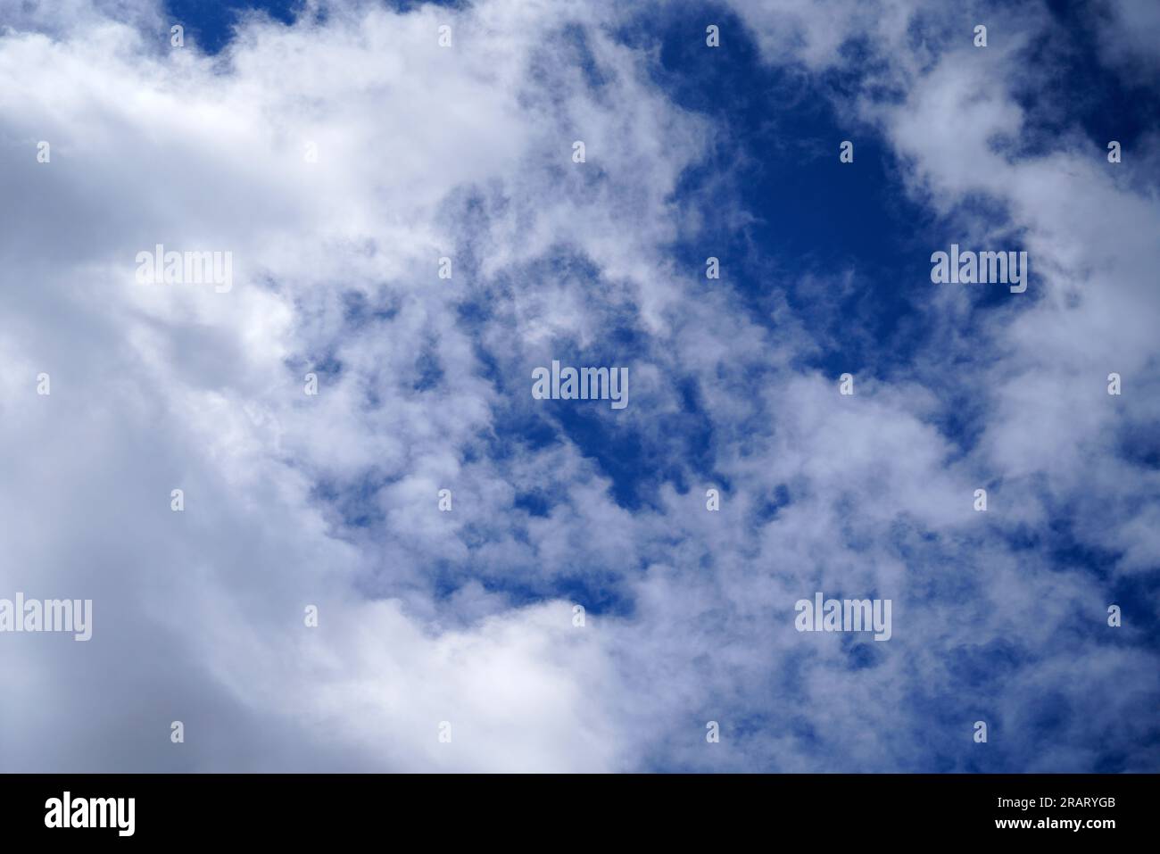 Stratus cumulus alto nimbo clouds in the blue sky are weather ...