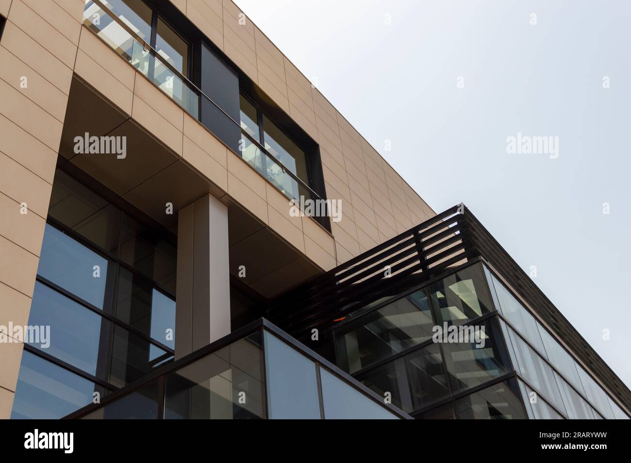 facade of a modern office building with large glass windows Stock Photo ...