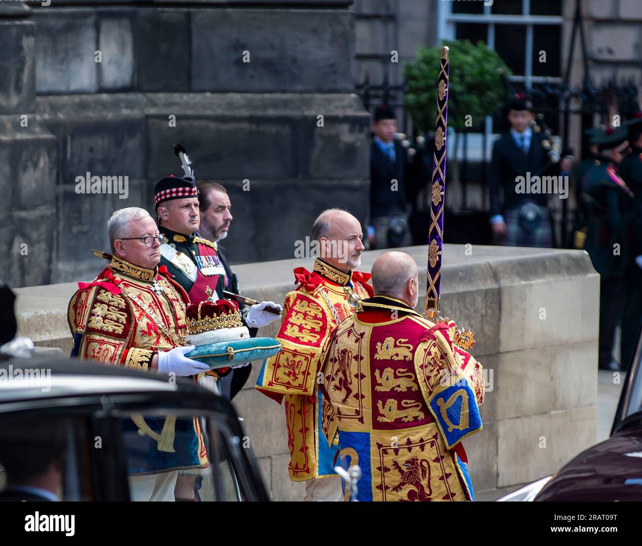 Lord Lyon King of Arms Joseph Morrow carries the Crown of Scotland, as ...