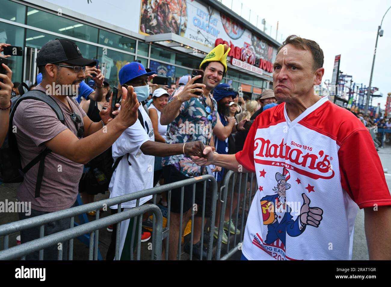 Professional competitive eater Joey Chestnut greets the crowd at the ...