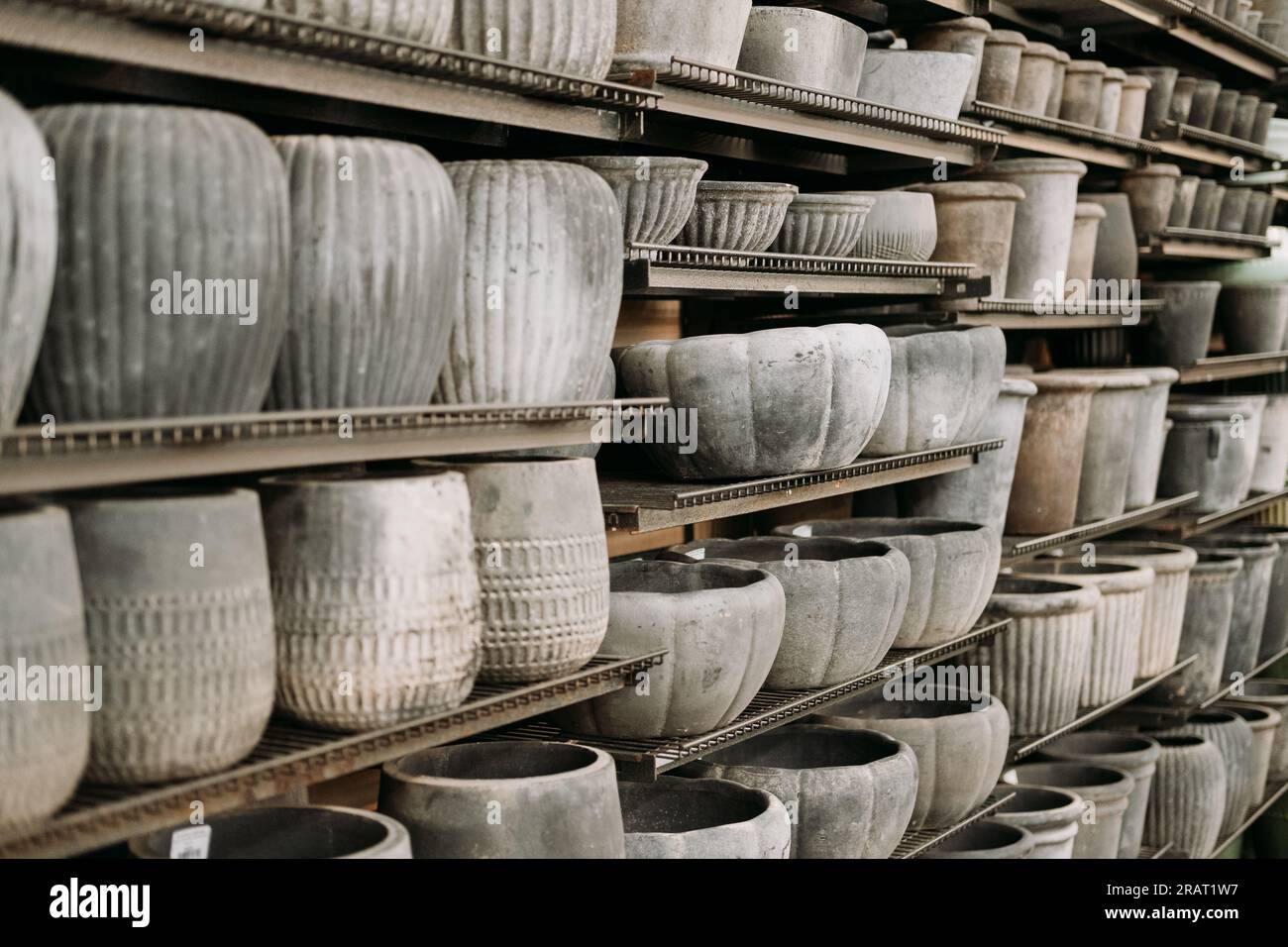 A variety of empty decorative ceramic flower pots in different sizes ...