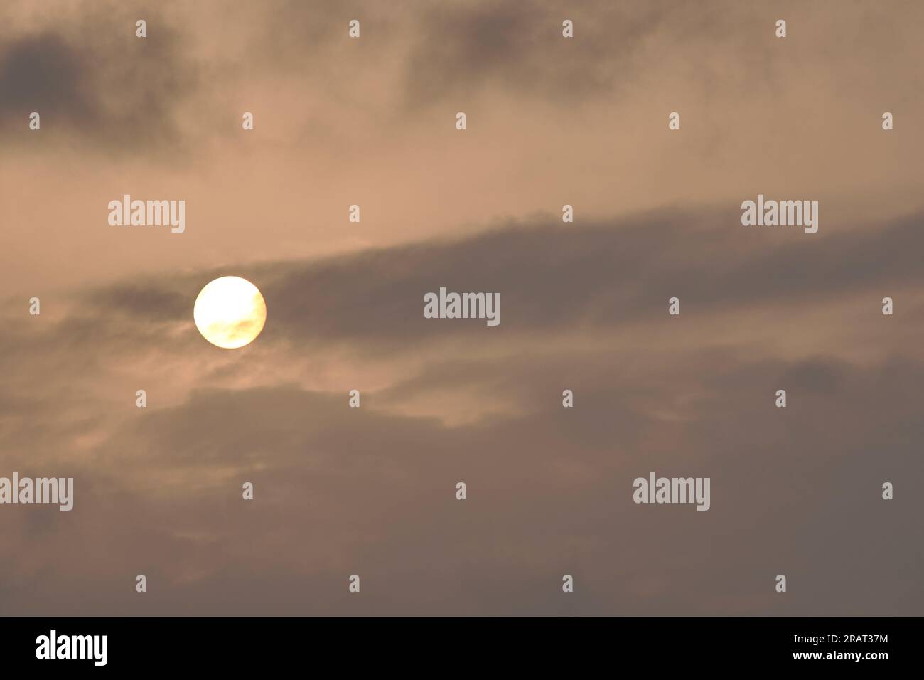 Sky, with diffused sun clouds colourful Stock Photo - Alamy