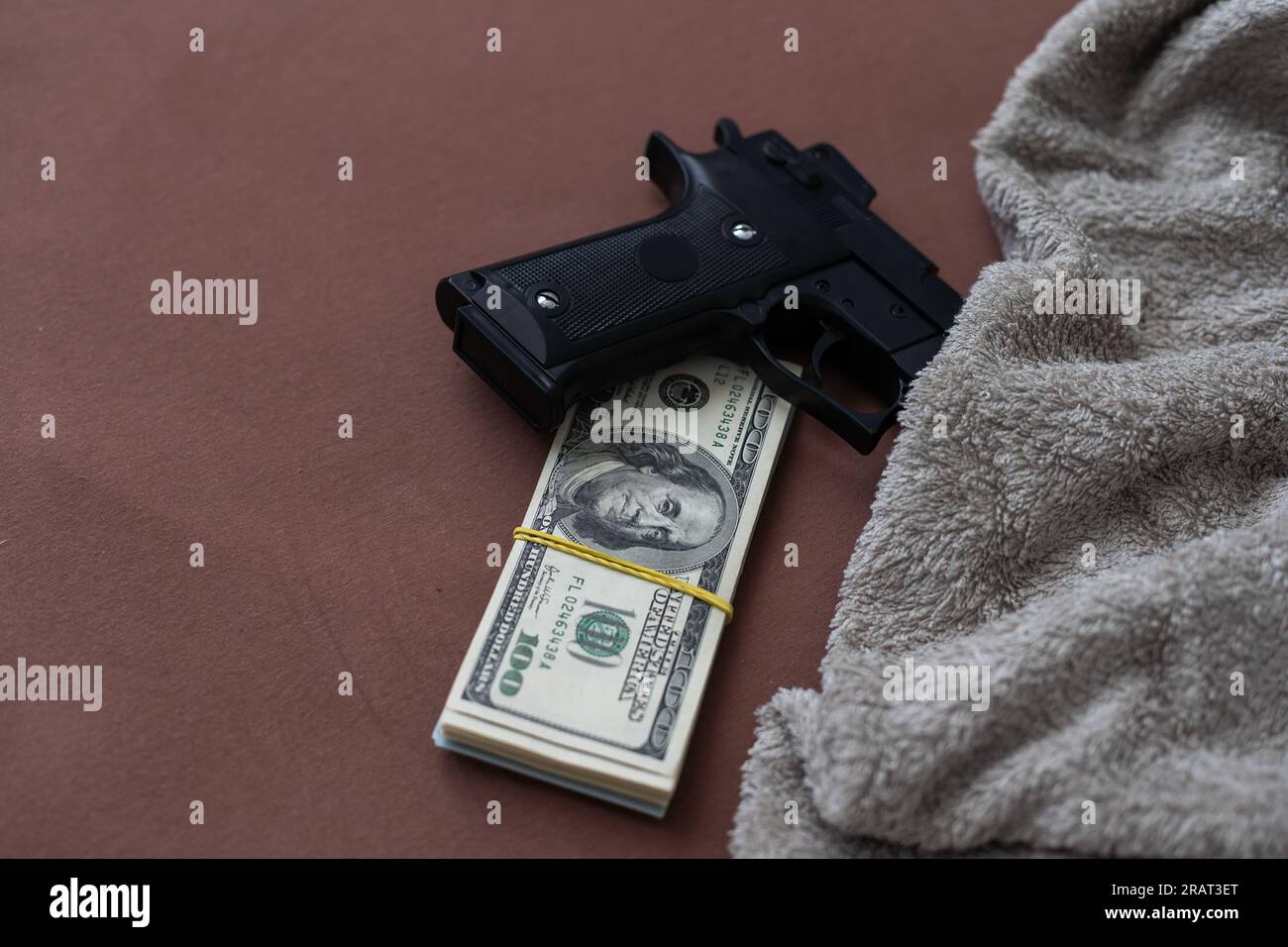 black gun on the background of cash dollars. the concept of criminal ...