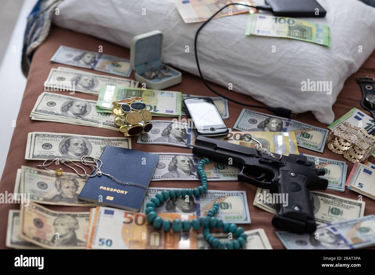 Evidence bag next to dollar banknotes in a crime investigation unit ...