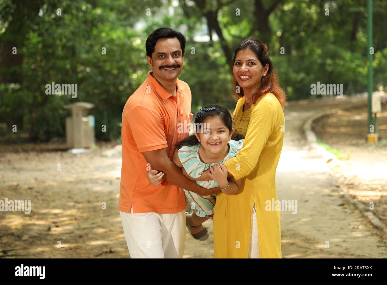 Happy Indian family with a girl child playing together and enjoying ...
