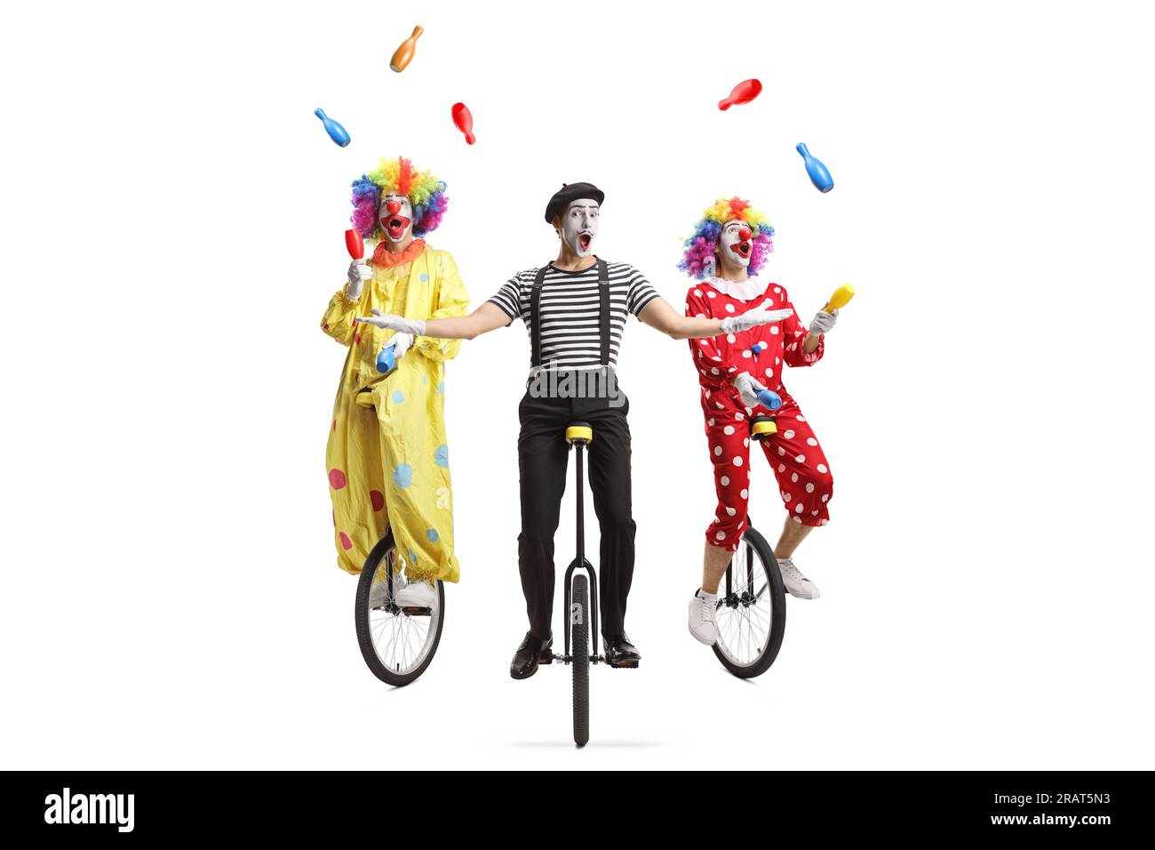 Two clowns and a mime riding unicycles and juggling isolated on white ...