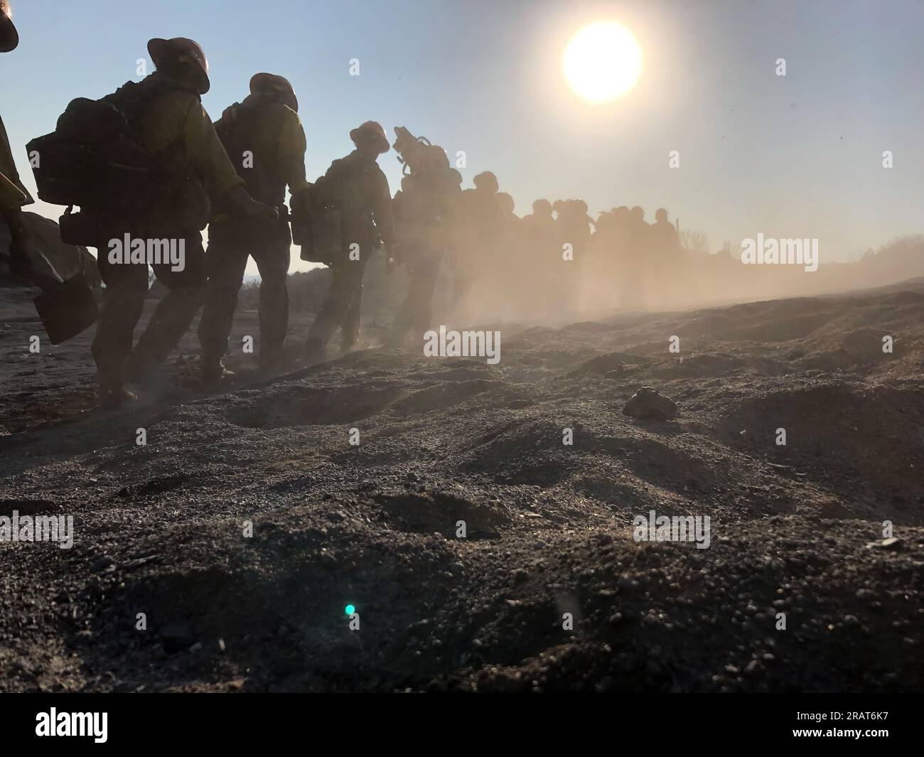 A hotshot crew hikes down the fireline on the Peak Fire in California ...