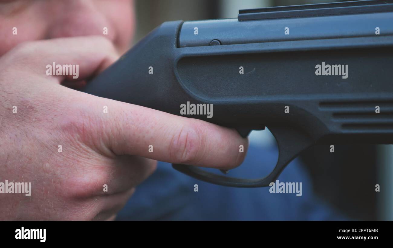 Man shooting with air gun hi-res stock photography and images - Alamy