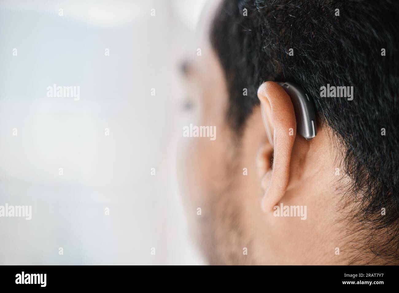 Hearing aid, closeup or ear of man with disability from the back on ...
