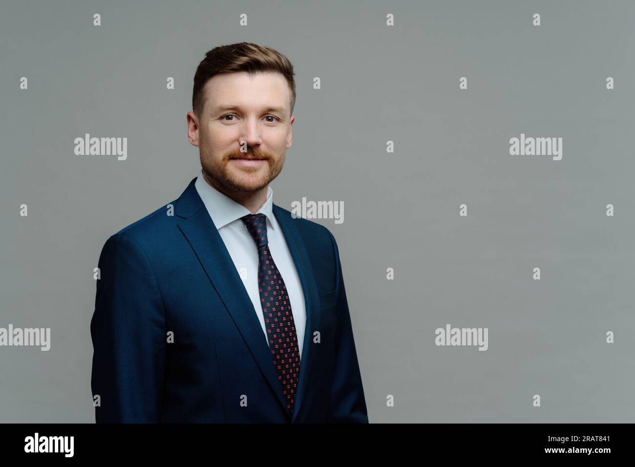 Confident male CEO, good reputation, smart at work, isolated on grey ...